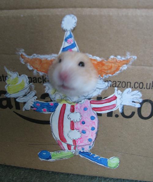 Adorable Hamster Dresses Up in Cardboard Cutouts (5 Pics)